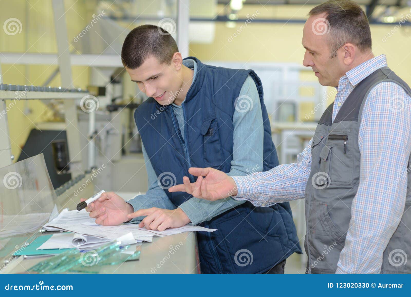Supervisor Questioning Young Worker Stock Photo - Image of questioning ...