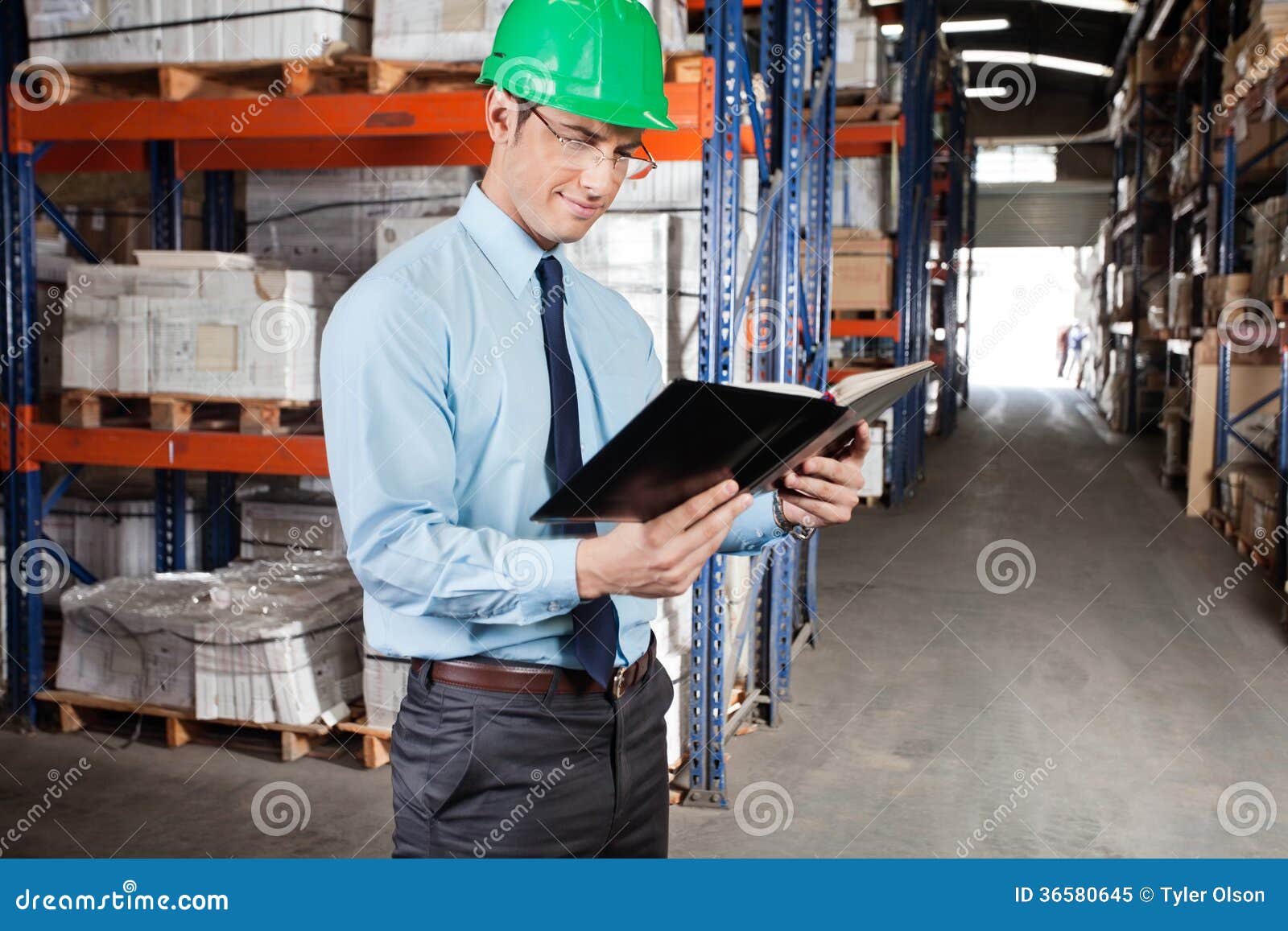 Supervisor Reading Book at Warehouse Stock Image - Image of helmet ...