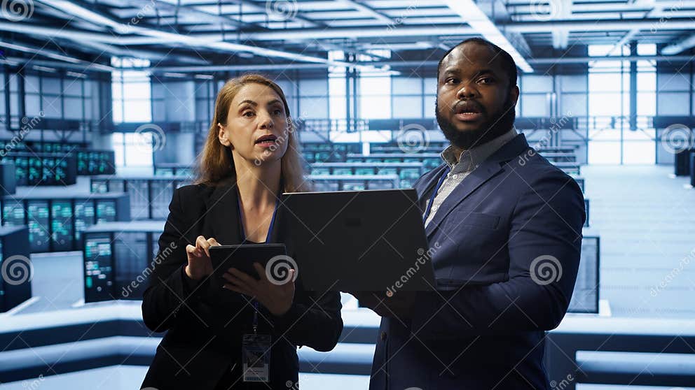 Supervisor in Server Farm Overseeing Engineer Fixing Network Issues Stock Photo - Image of ...