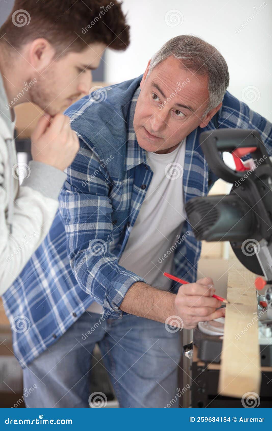 Supervisor Showing Apprentice How To Use Circular Saw Stock Photo ...