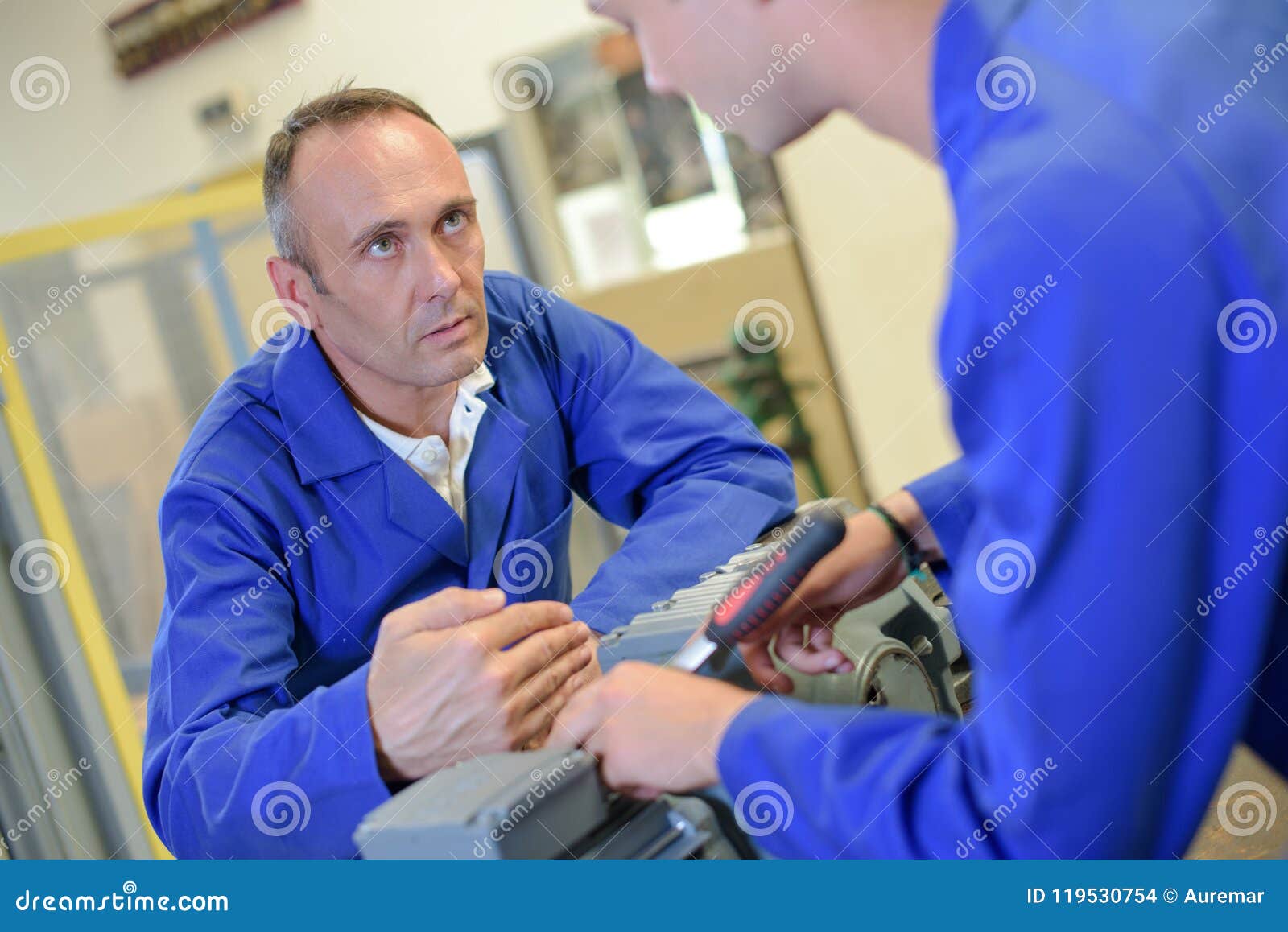 Supervisor Talking To Trainee Stock Photo - Image of junior, showing ...