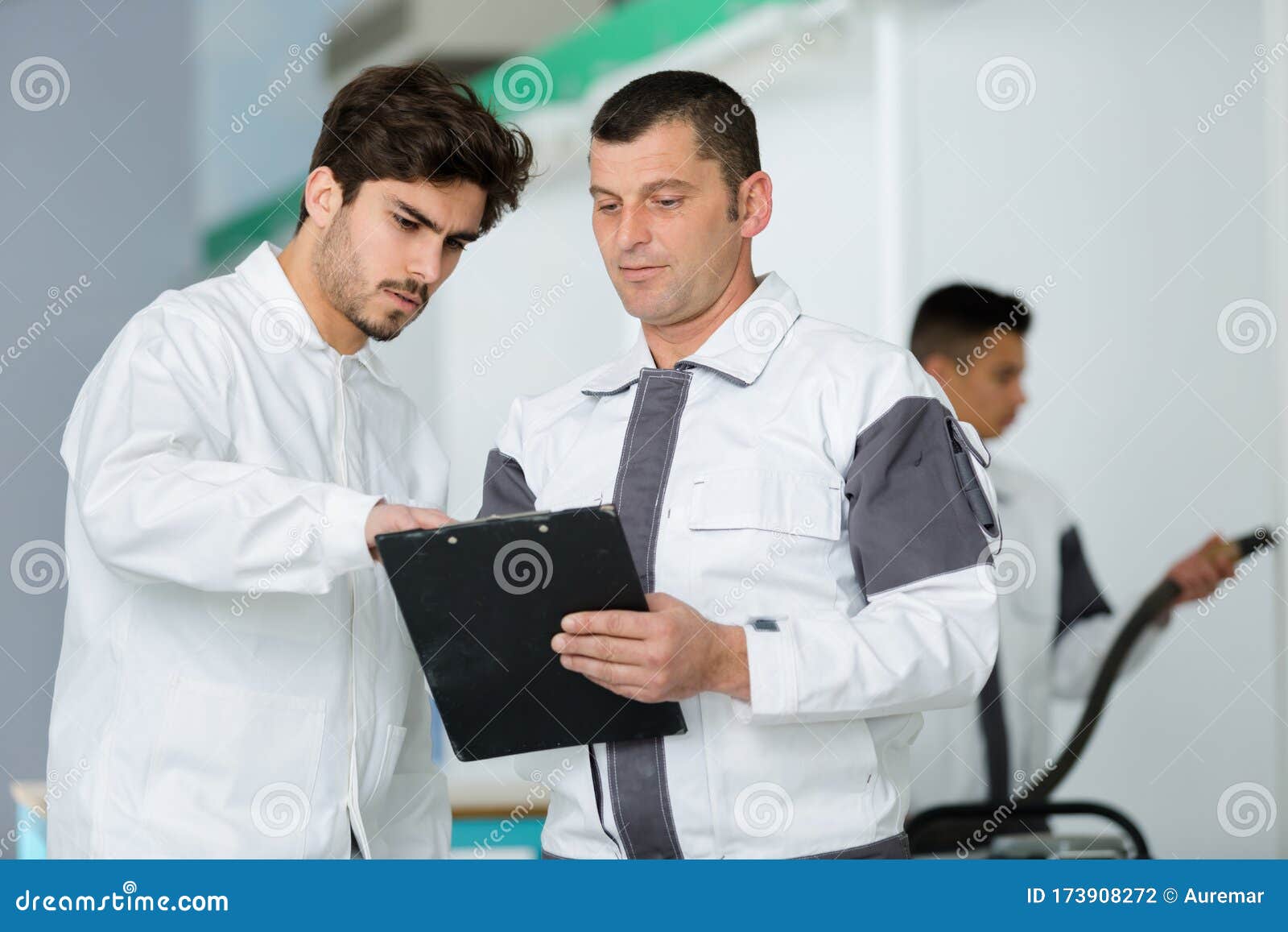 Supervisor Talking To Young Decorator Stock Photo - Image of ...