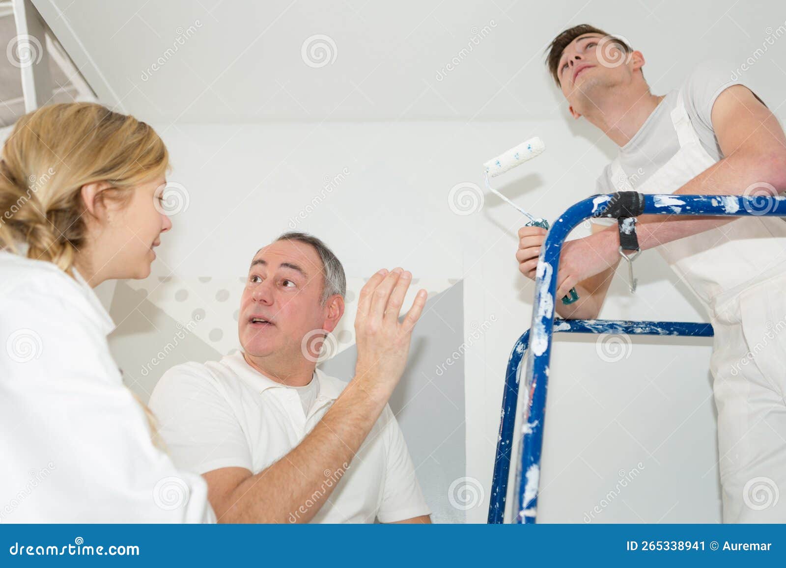 Supervisor Teaching Young Decorating Team Stock Image - Image of roller ...