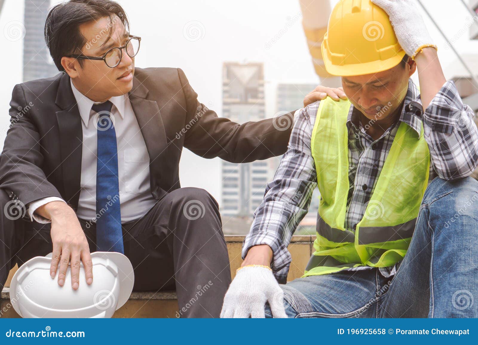 Supervisor Touching Worker Shoulder Consoling after Accident in ...