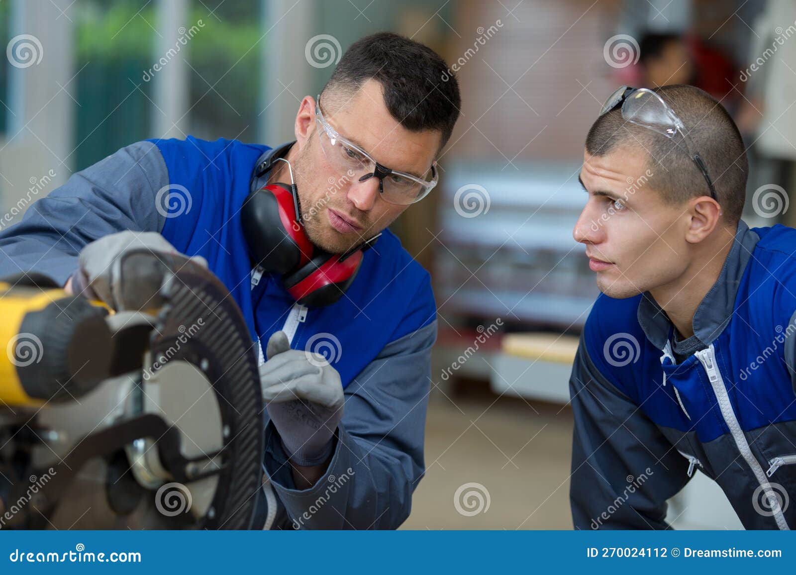 Supervisor Training Apprentice To Use Circular Saw Stock Photo - Image ...