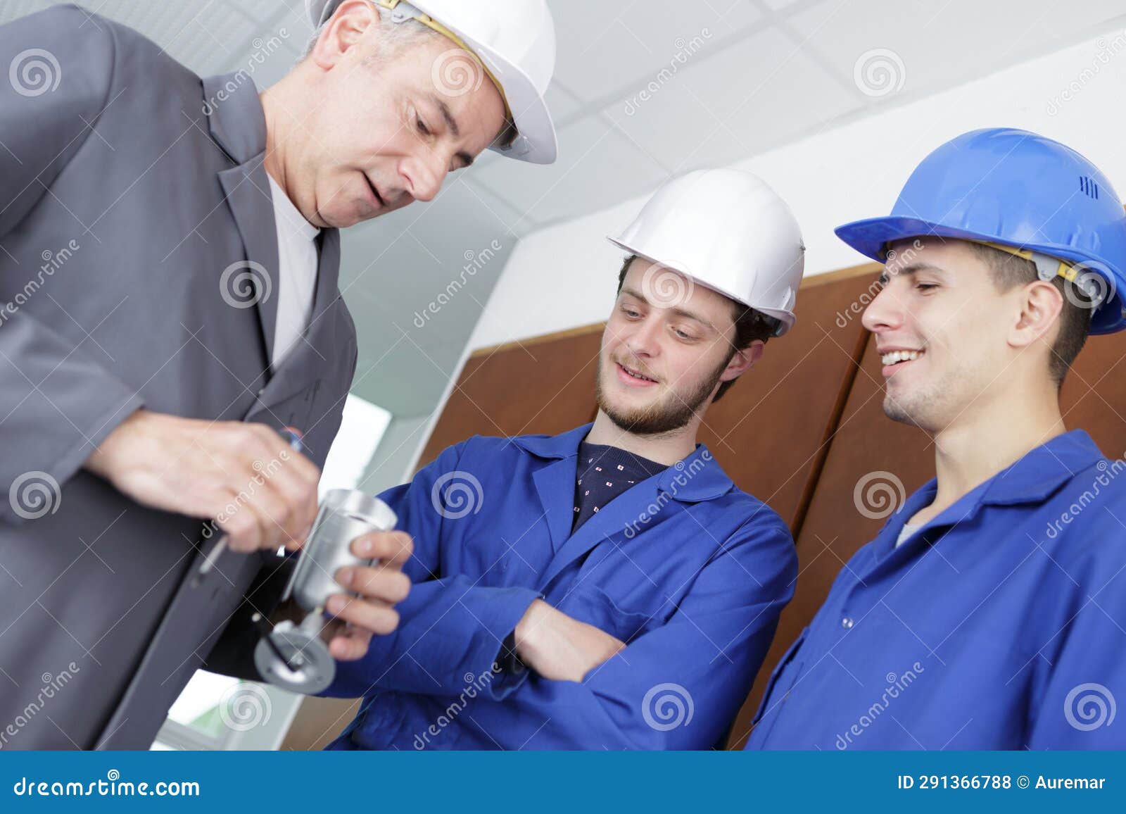 Supervisor with Two Young Male Students Stock Photo - Image of ...