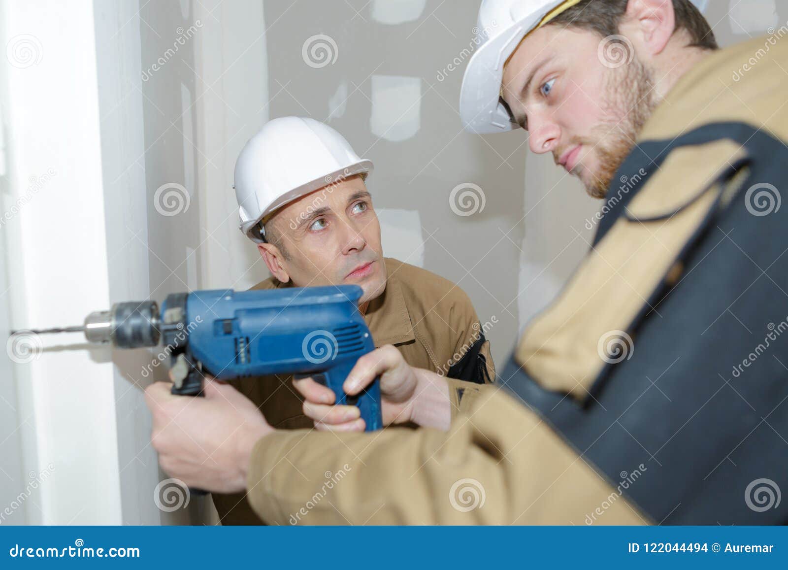 Supervisor Watching Apprentice Use Drill Stock Photo - Image of bore ...