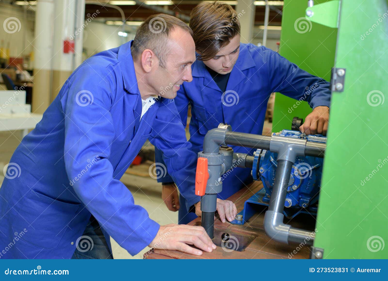 Supervisor Watching Apprentice Use Machine Stock Image - Image of ...