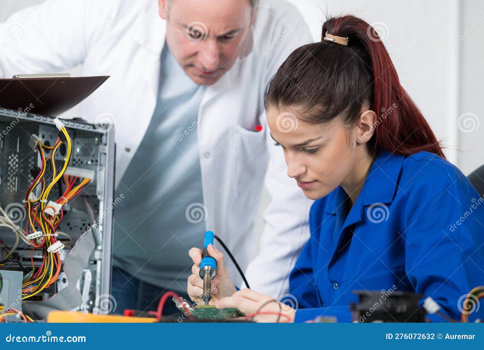 Supervisor Watching Trainee Technician Solder Computer Component Stock ...