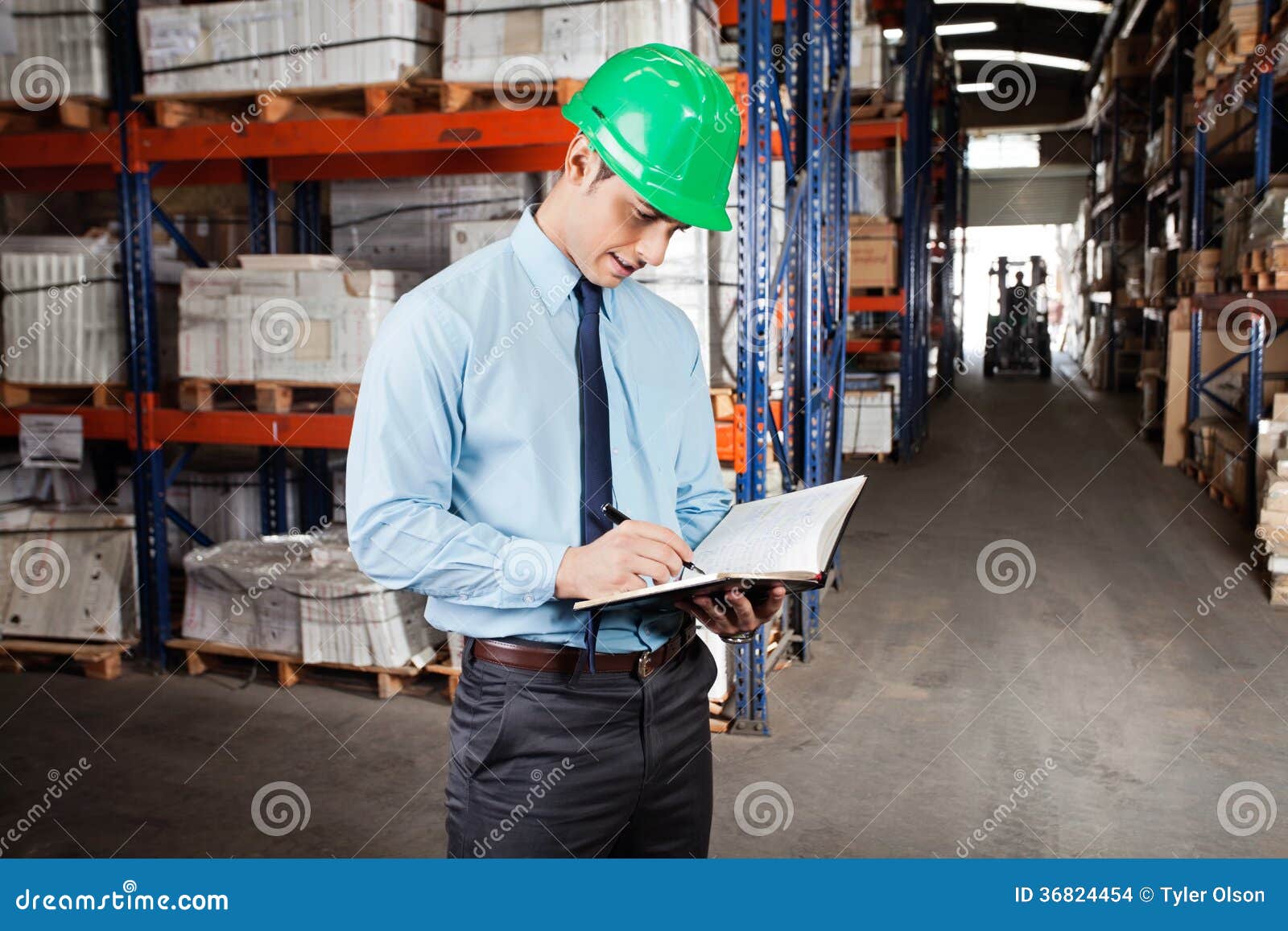Supervisor Writing Notes at Warehouse Stock Photo - Image of order ...