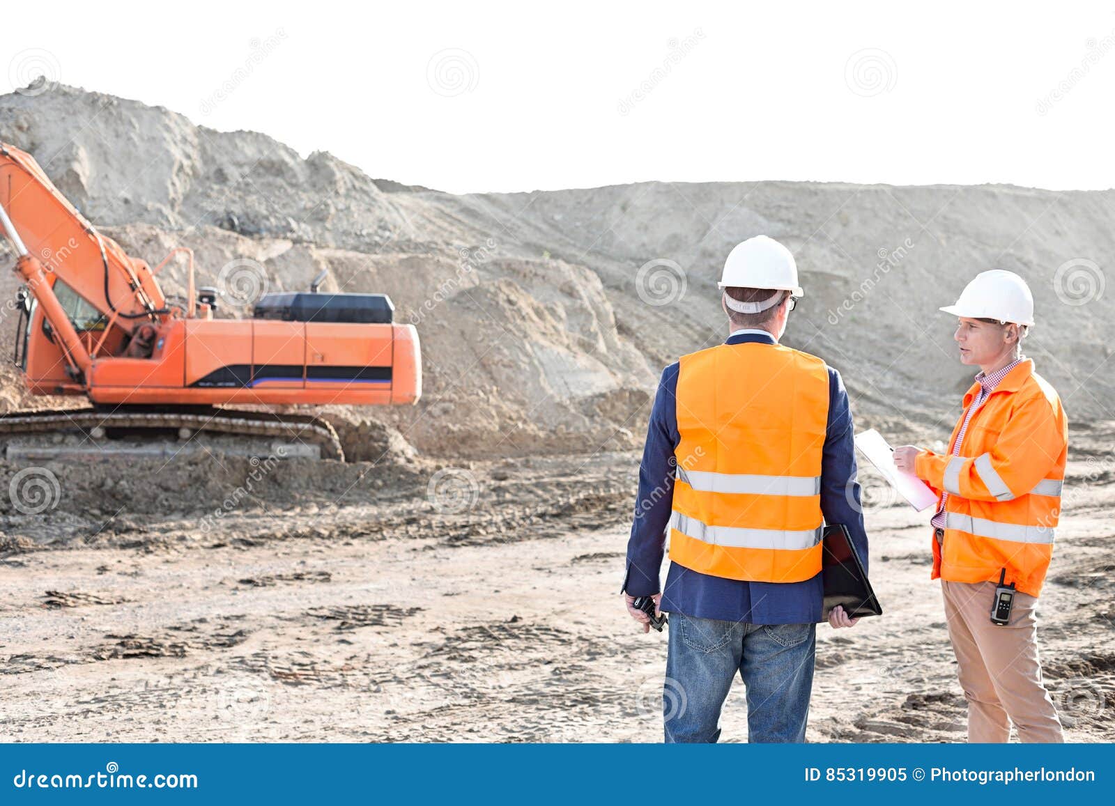 Supervisors Standing at Construction Site Against Clear Sky Stock Image ...