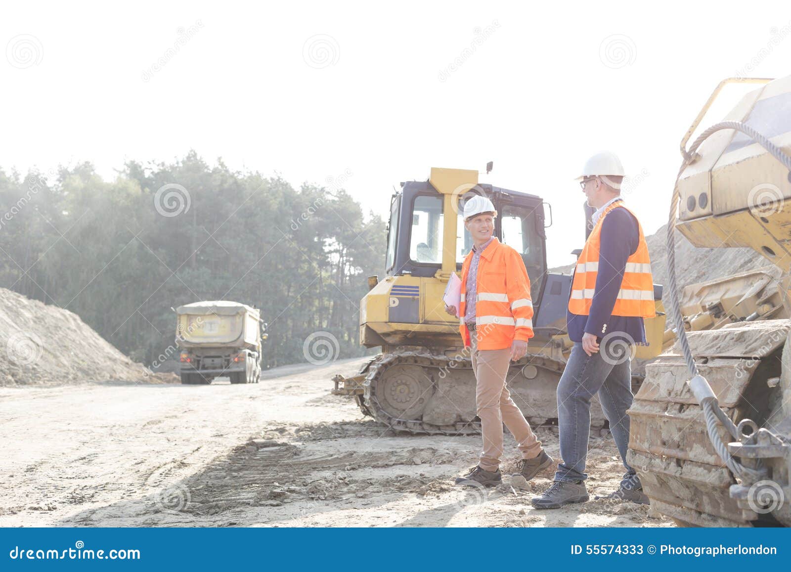 Supervisors Walking at Construction Site Against Clear Sky Stock Image ...