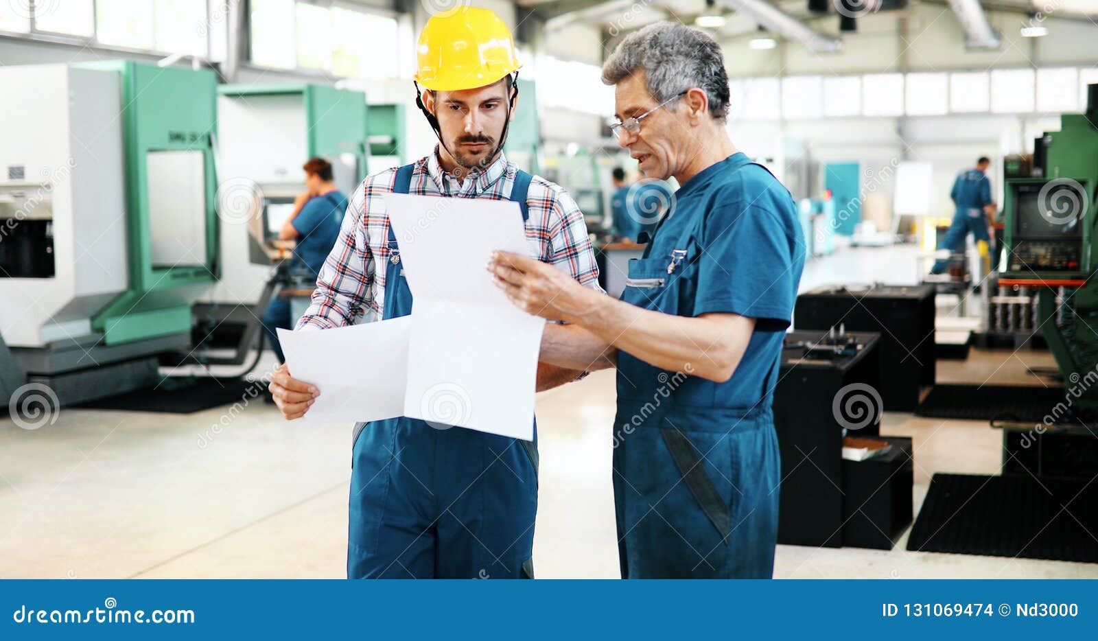 Supplier with Engineer Checking on Production in Factory Stock Photo ...
