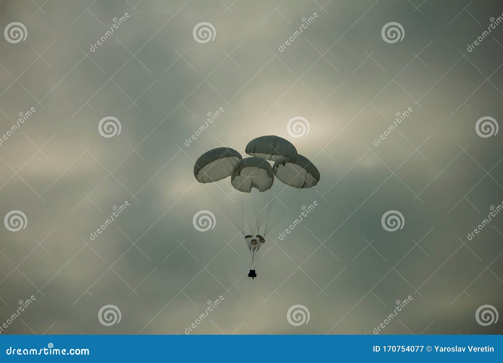 Supply Box Dropped with Parashute at Military Field Stock Image - Image ...