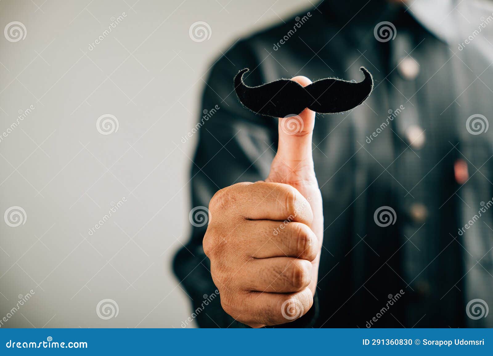 In Support of Prostate Cancer Awareness, a Man Holds a Mustache with ...
