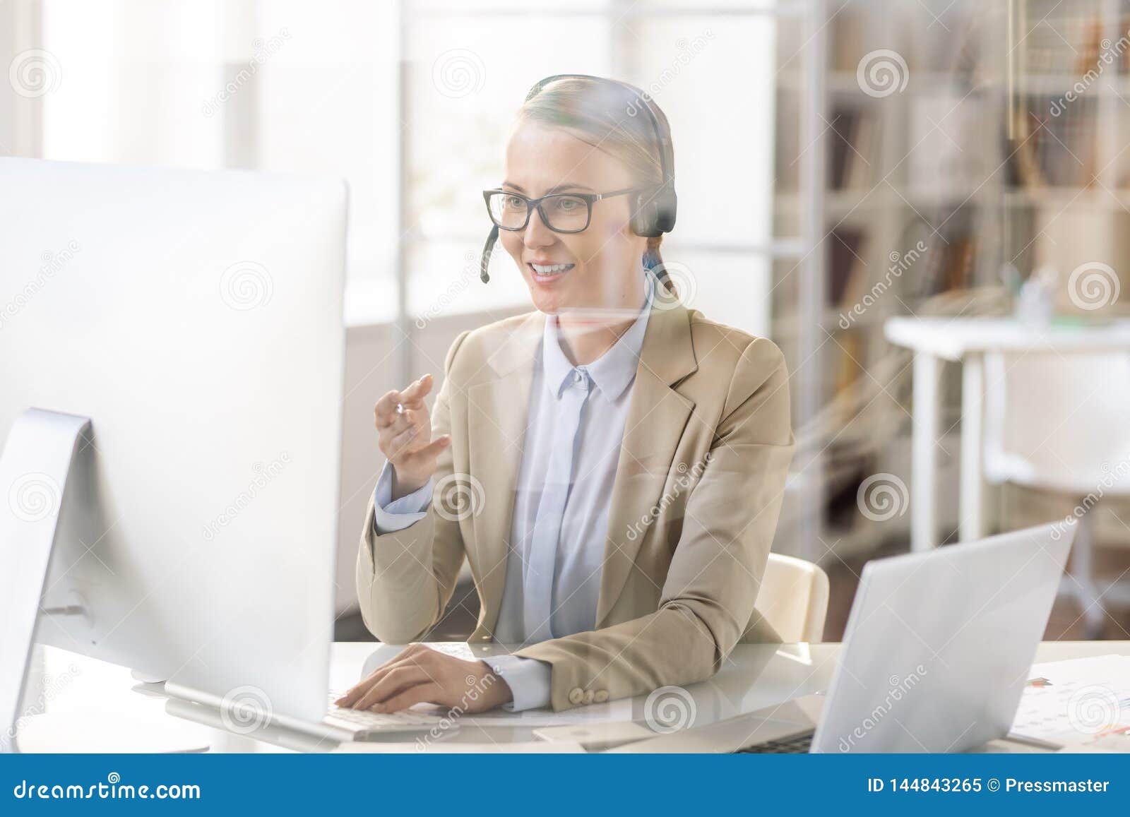 Support Service Operator Talking To Client by Hands-free Device Stock ...