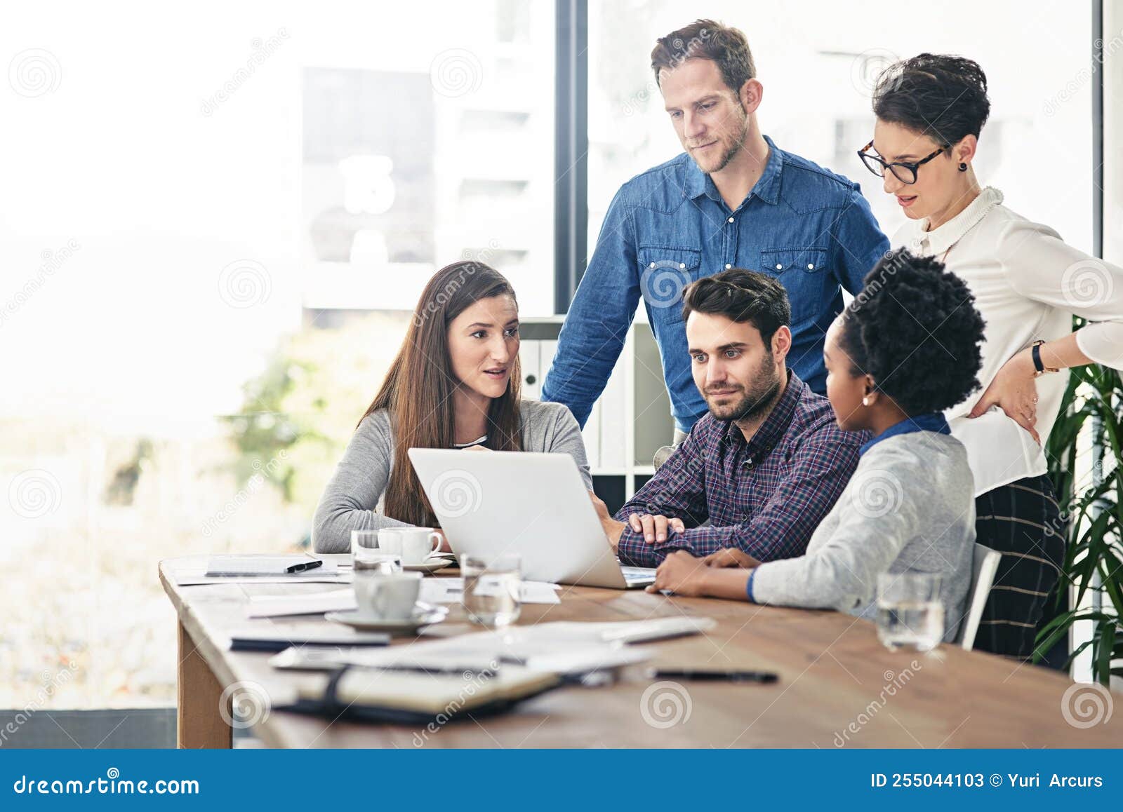Support through Teamwork. a Group of Businesspeople Meeting in the ...