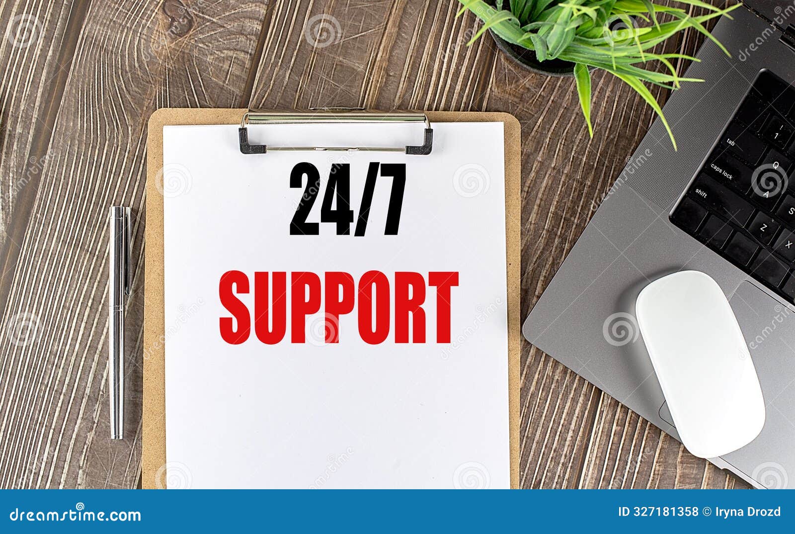 24 7 SUPPORT Text on Clipboard Paper with Laptop, Mouse and Pen Stock ...