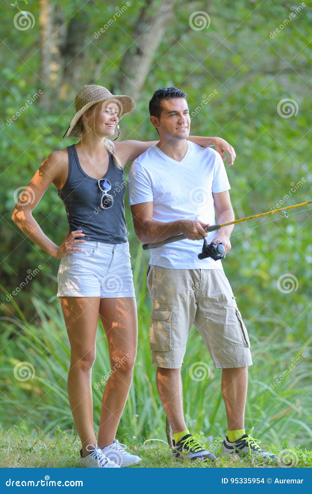 Supporting Partner while Fishing Stock Photo - Image of outdoor, green ...