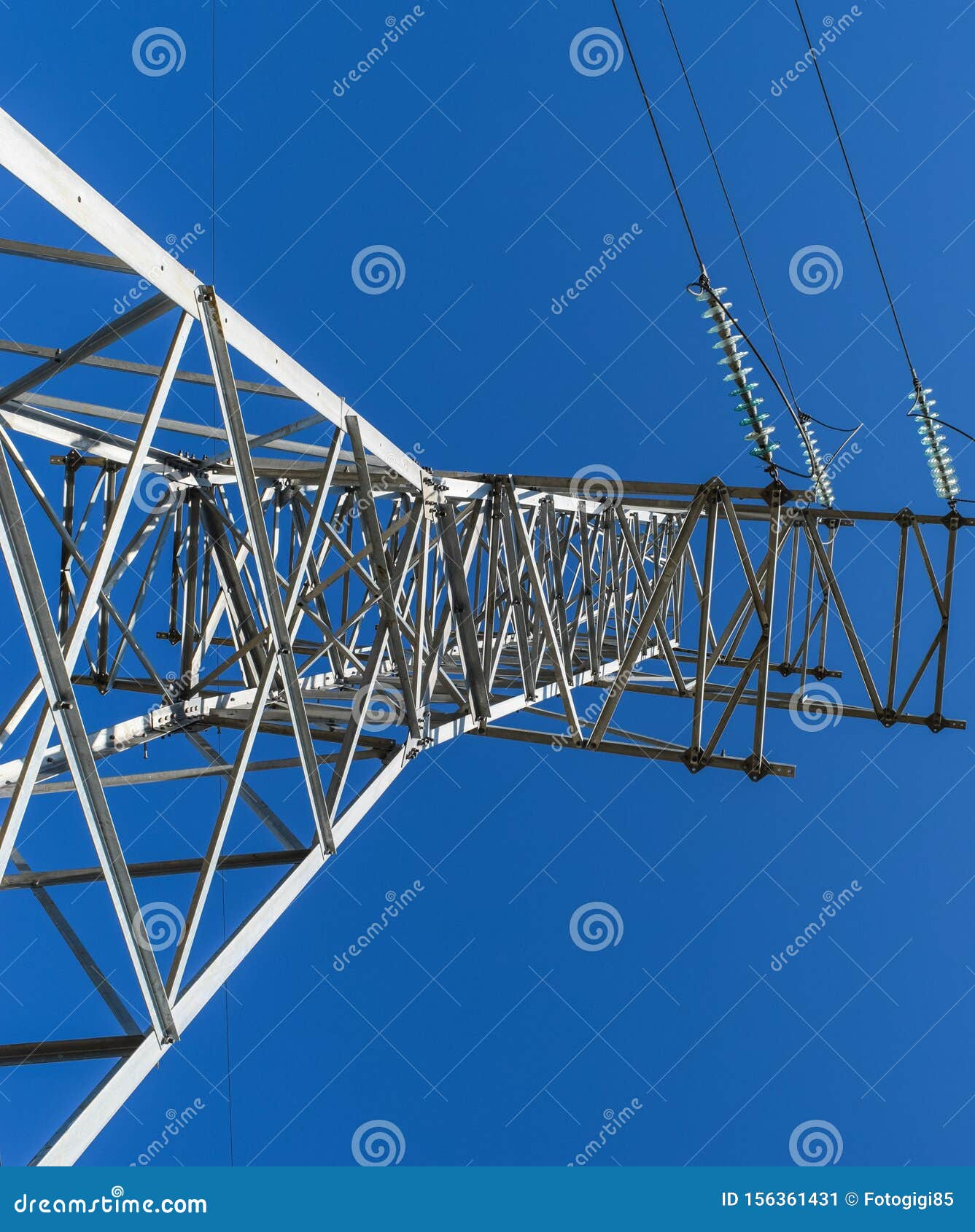 Supports High-voltage Power Against the Blue Sky. View from the Bottom ...