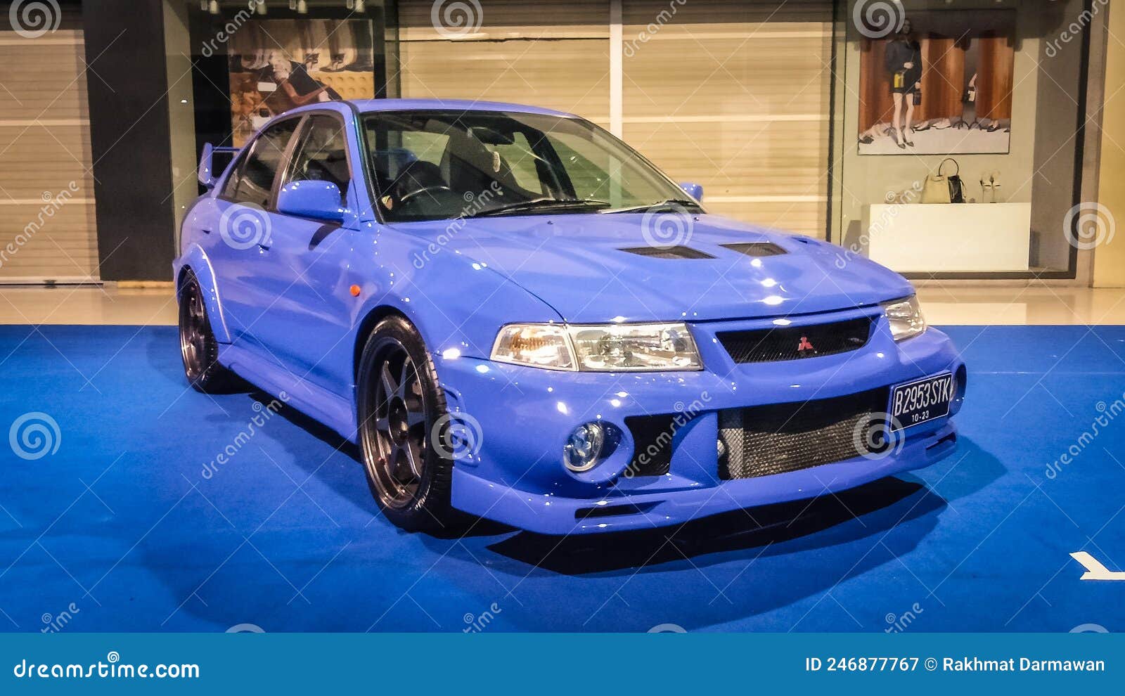 Blue Mitsubishi Lancer Evolution VI Being Displayed in a Car Show ...