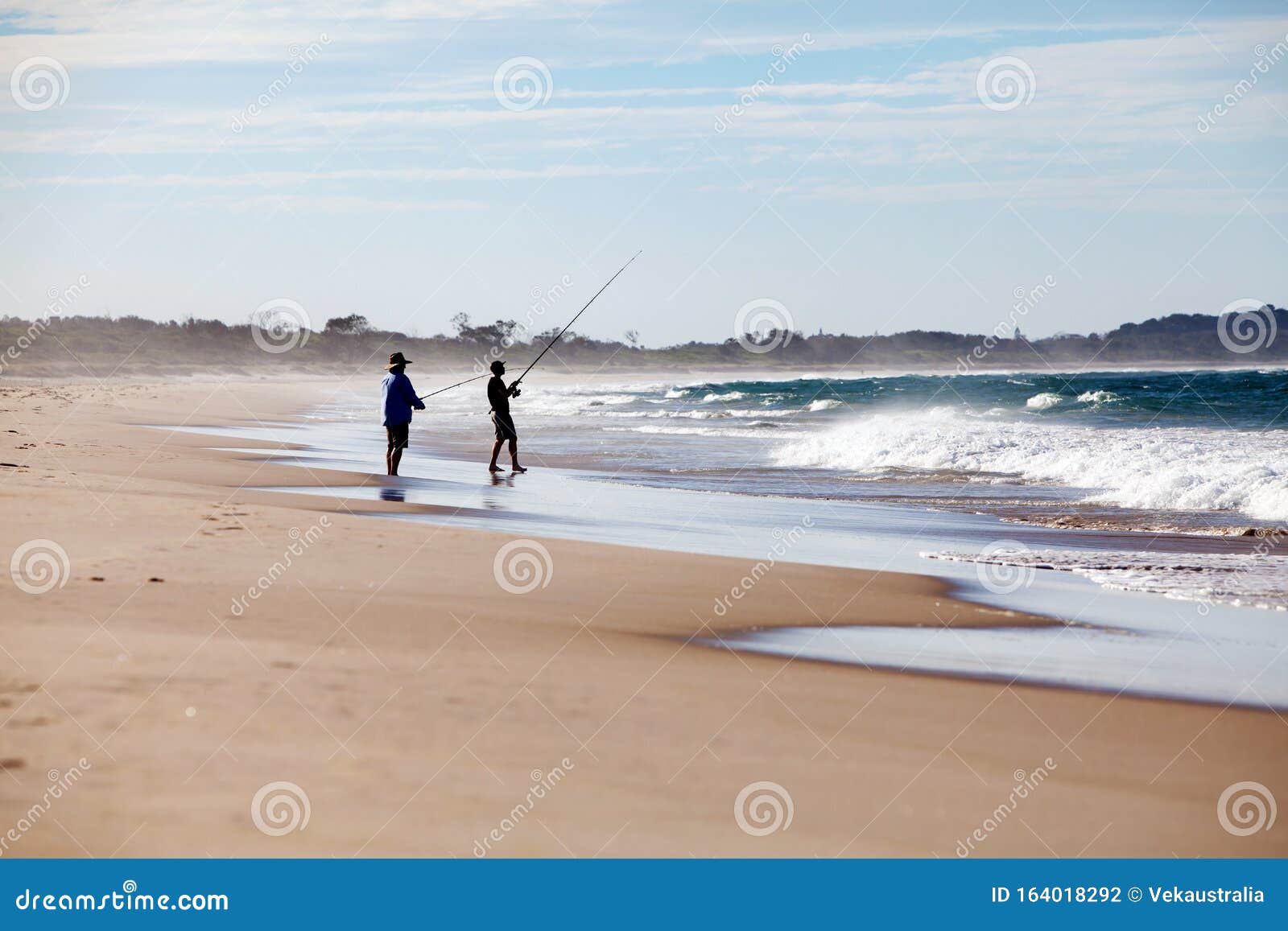 Surf Cast Fishing on an Ocean Beach Stock Photo - Image of waves, wave ...