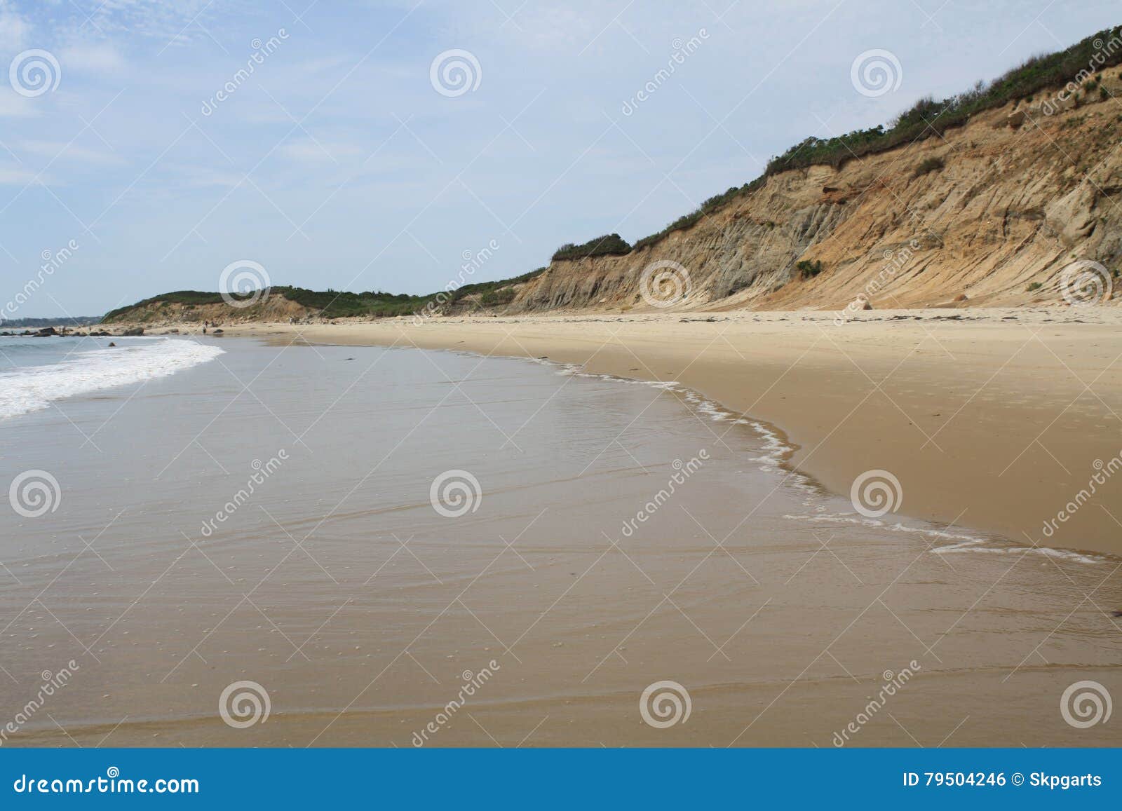 Surf Creeping Up the Beach stock photo. Image of rugged - 79504246