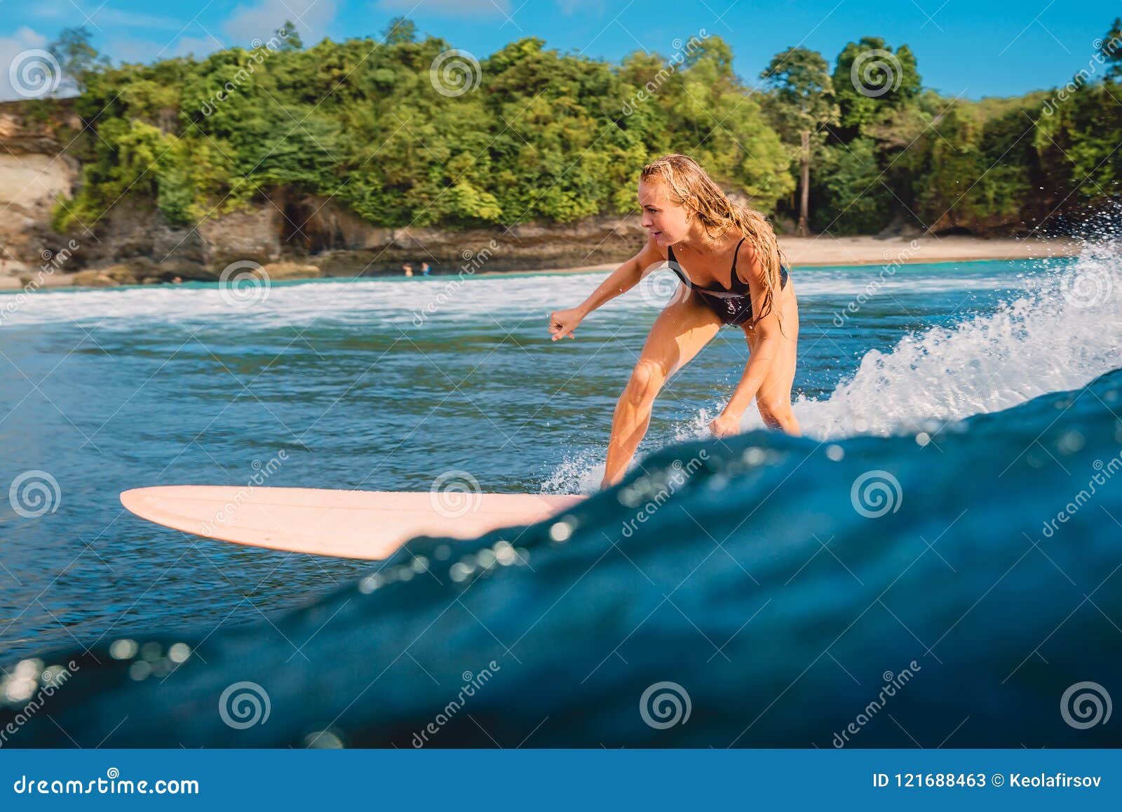 Surf Girl On Surfboard Woman During Surfing Surfer And Wave Stock