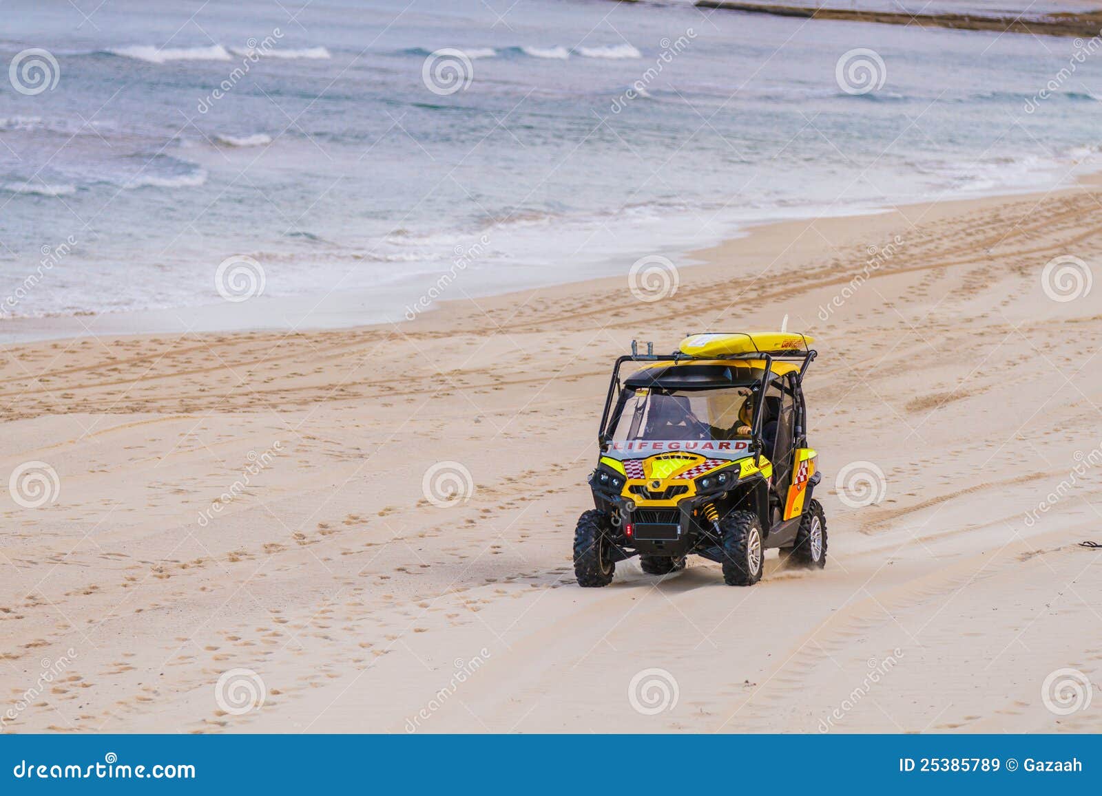 Surf Lifeguard Vehicle Driving on a Beach Stock Image - Image of surf ...