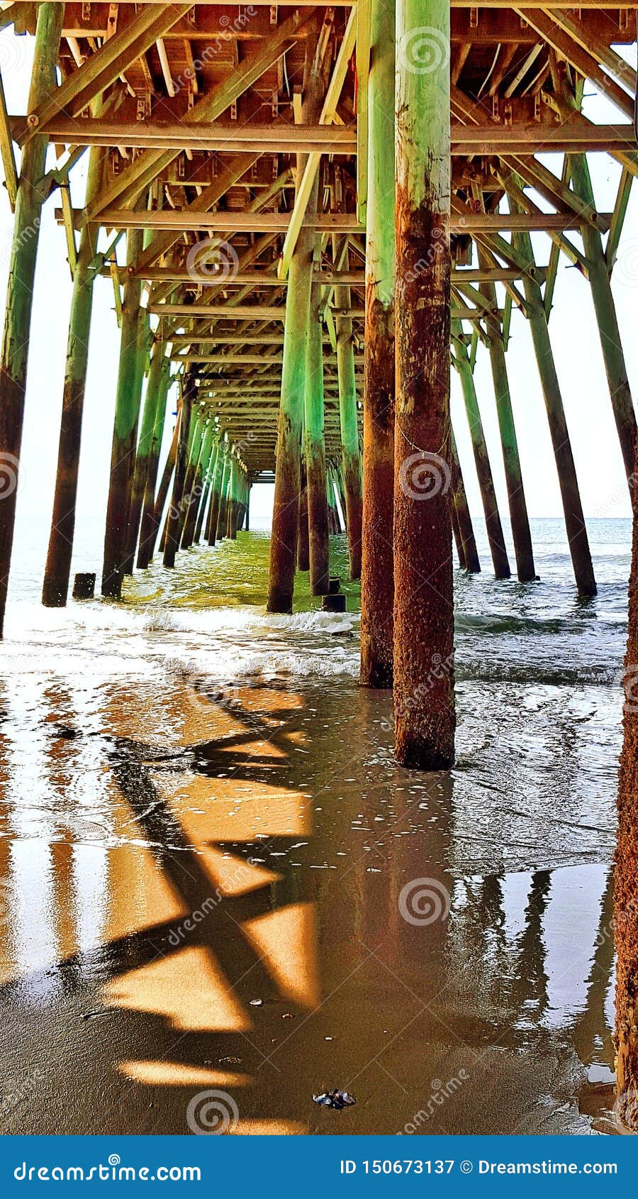 Surf under pier stock image. Image of ocean, pier, wave - 150673137