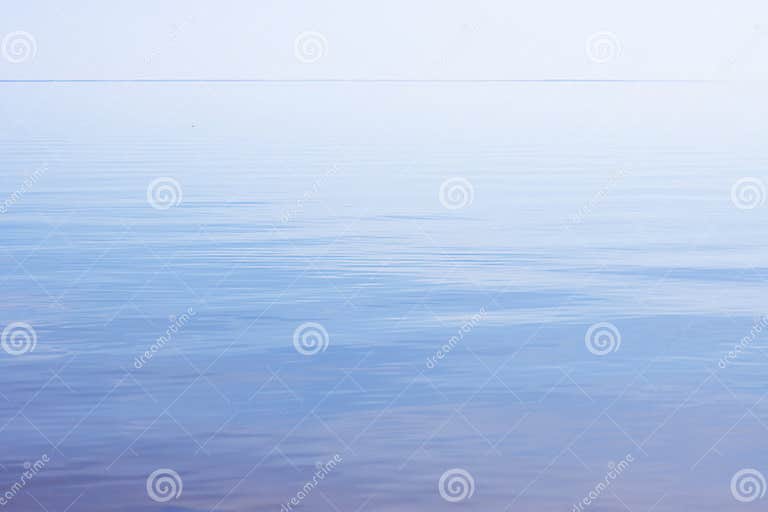 The Surface of a Blue Sea, a River without Waves Under a Clear Blue Sky ...