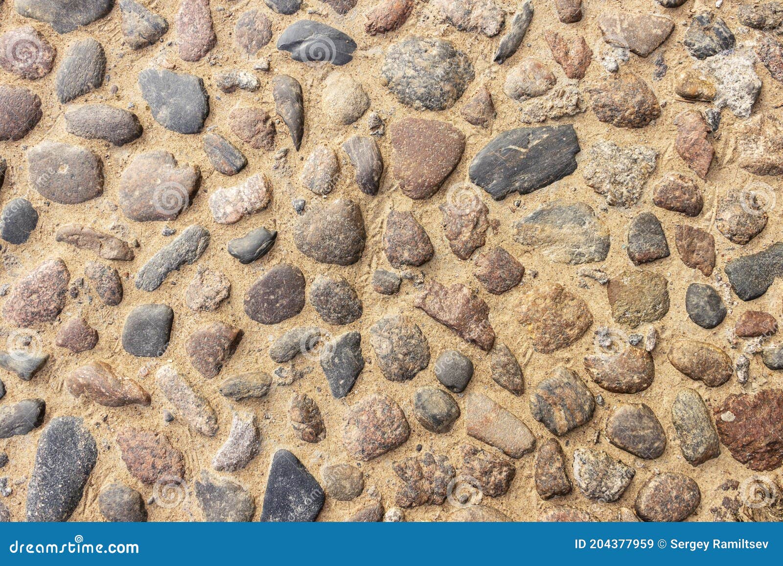 The Surface of the Cobblestone Pavement, Lined with Round Stones Stock ...