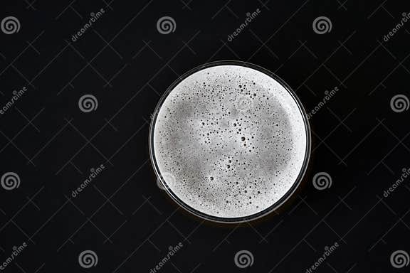 The Surface of a Glass of Beer. Beer Foam in a Glass Stock Photo ...