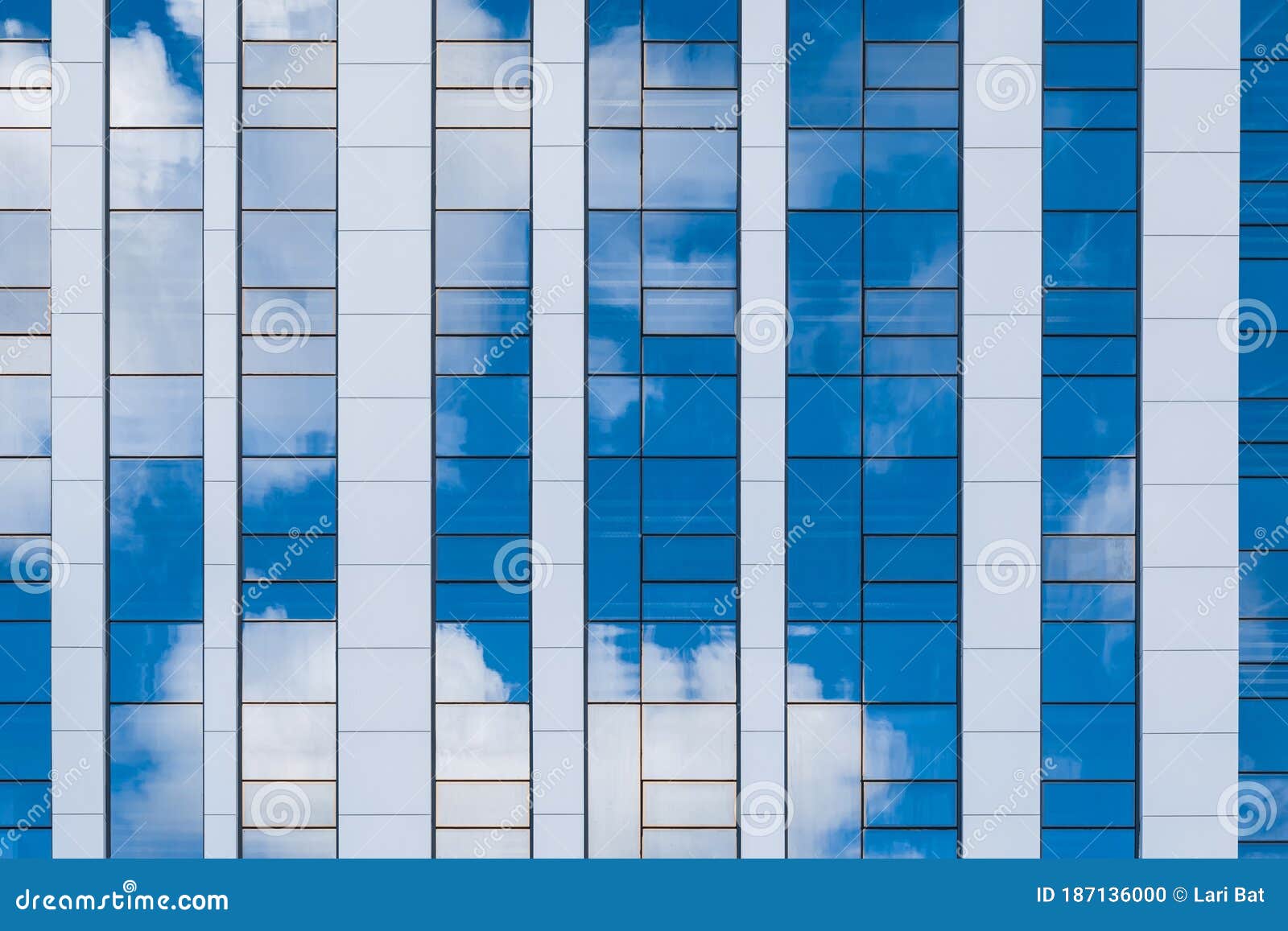 The Surface of a Glass High-rise Building with Reflection of Clouds ...