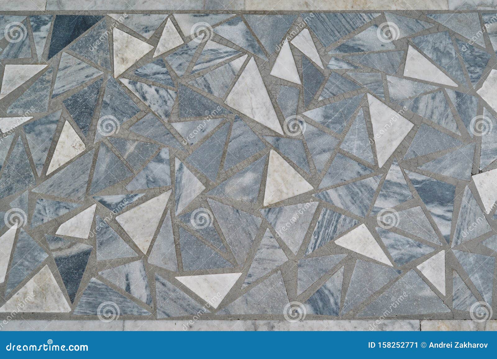 The Surface is Laid with a Mosaic of Triangular Tiles of Various Sizes ...