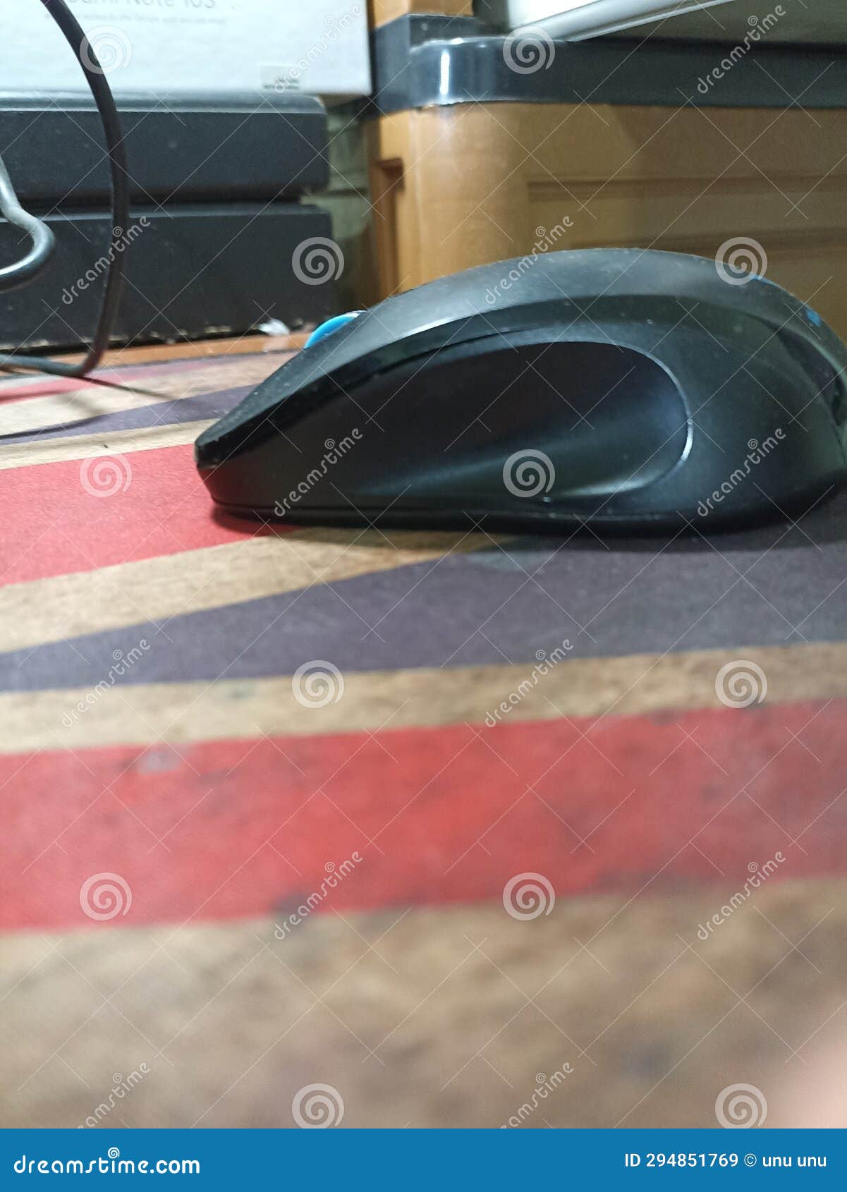 The Surface of the Mouse Pad is Red with a Black Mouse on it Stock ...