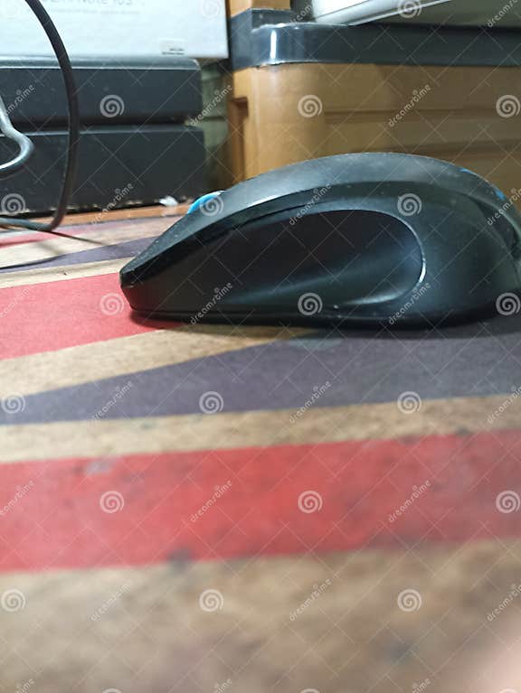 The Surface of the Mouse Pad is Red with a Black Mouse on it Stock ...