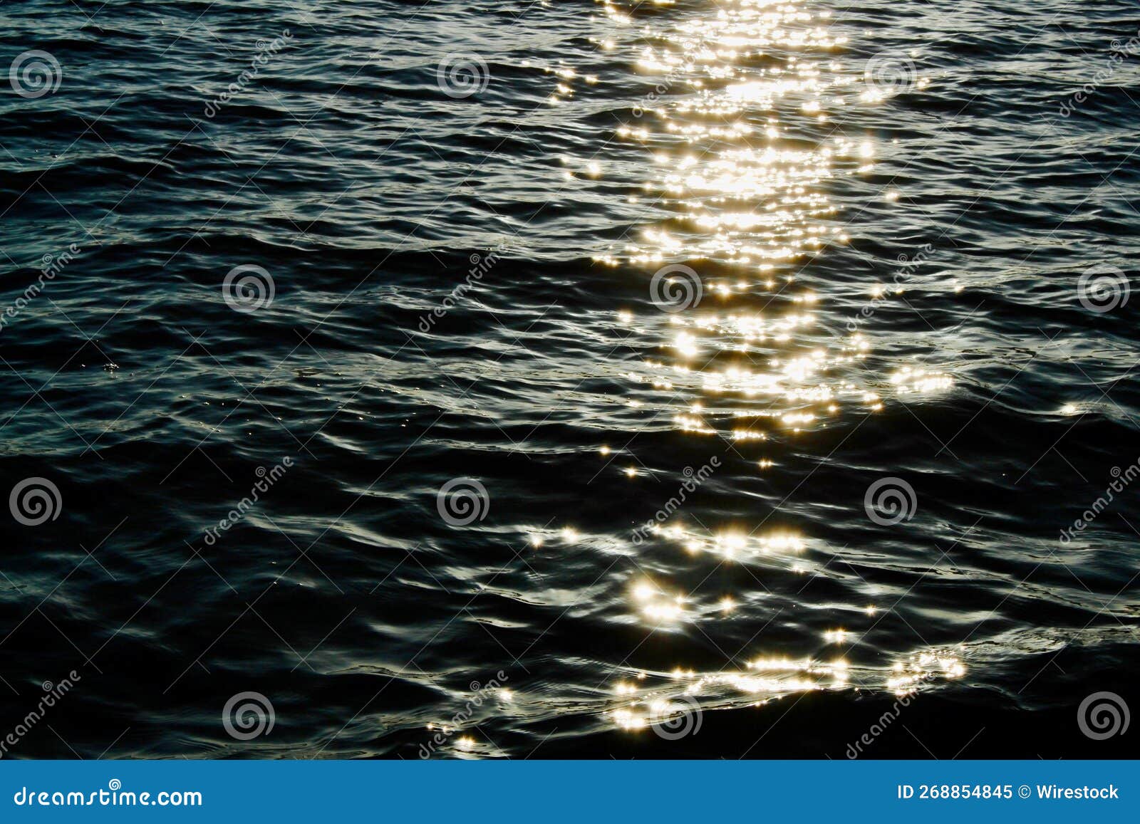 Surface of the Sea with Calm Water and Reflection of the Setting Sun ...