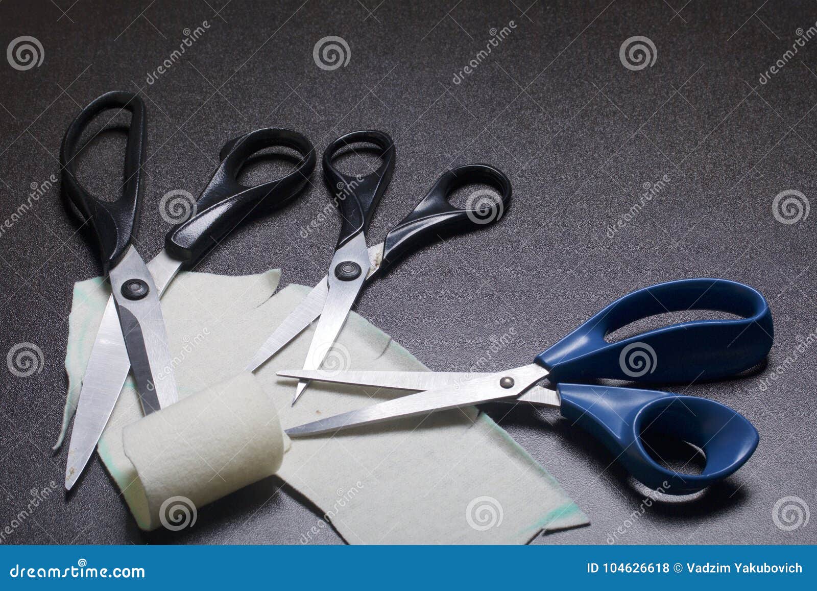 On the Surface of the Table are Three Pairs of Scissors and a Patch of ...