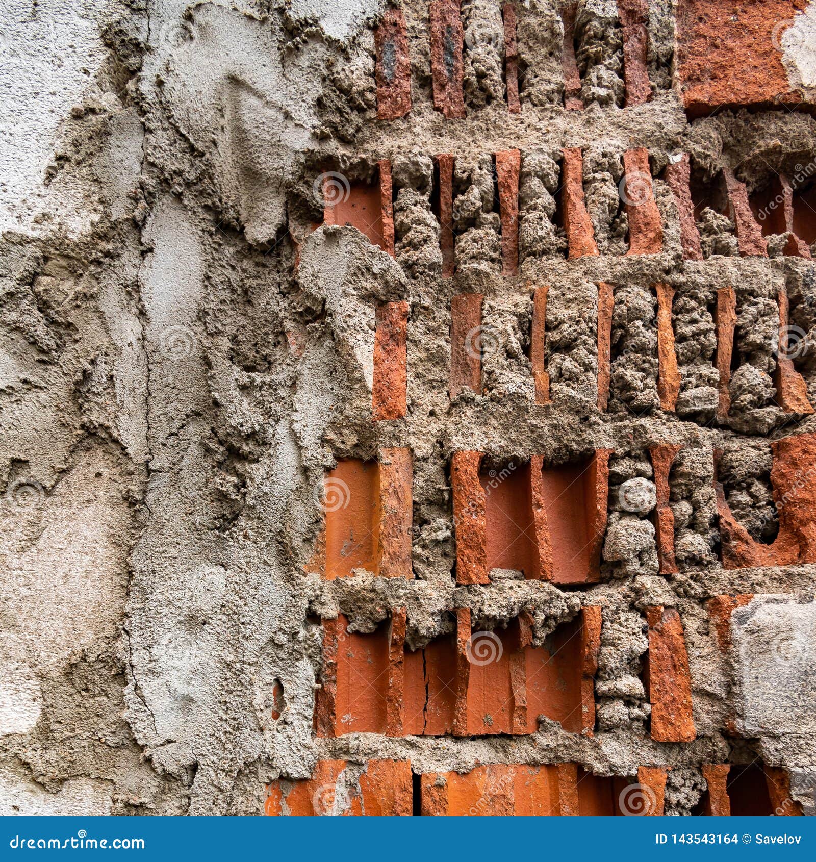 The Surface Of The Wall With Chipped Bricks And Cement Royalty-Free ...