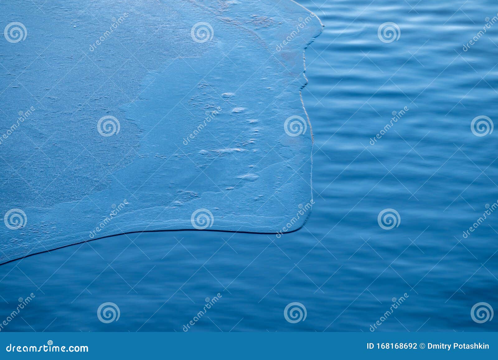 The Surface of the Water is Partially Covered with Ice Stock Photo ...