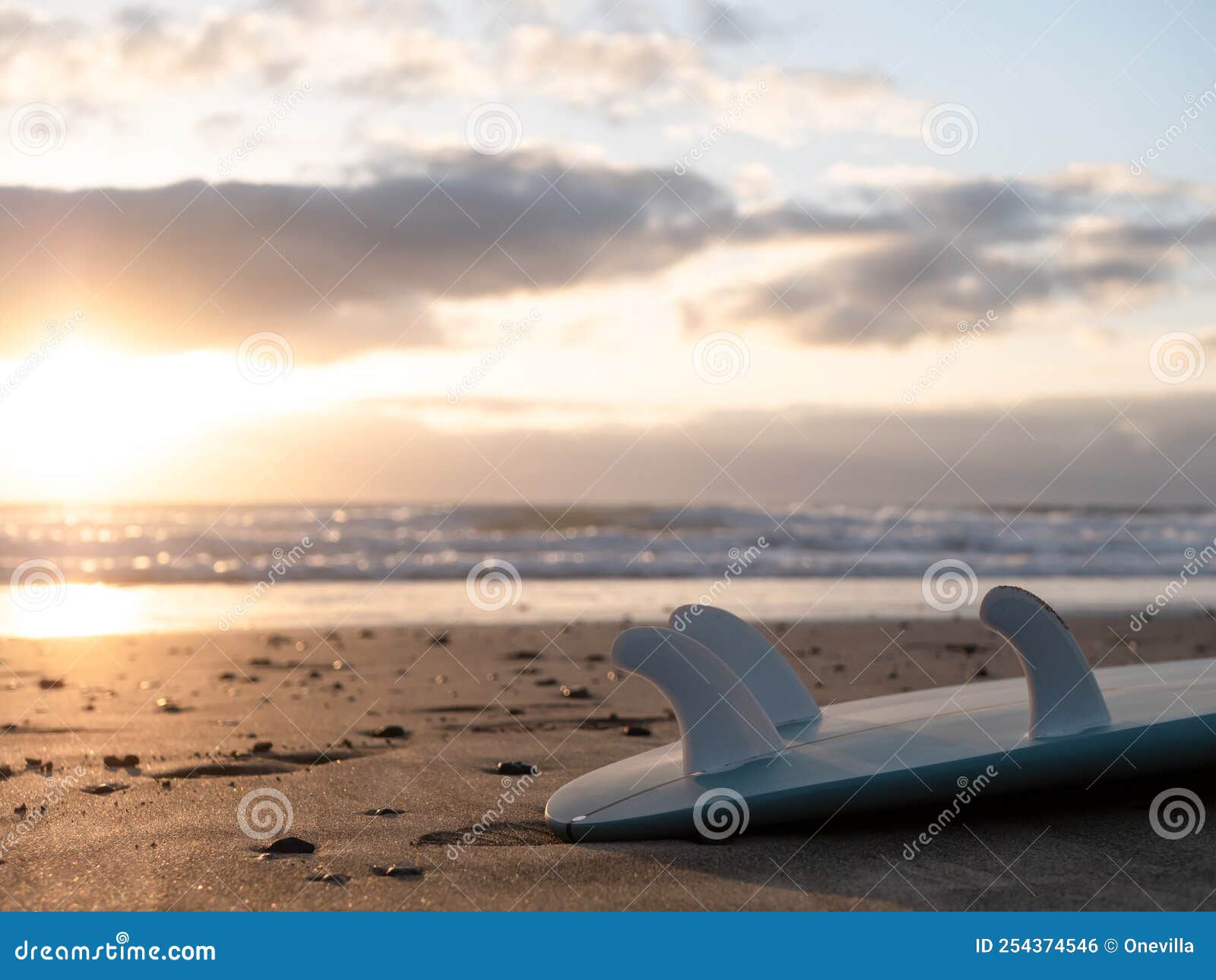 Tri Fin Surfboard on the Beach Shore at Sunrise Close Up Stock Photo ...