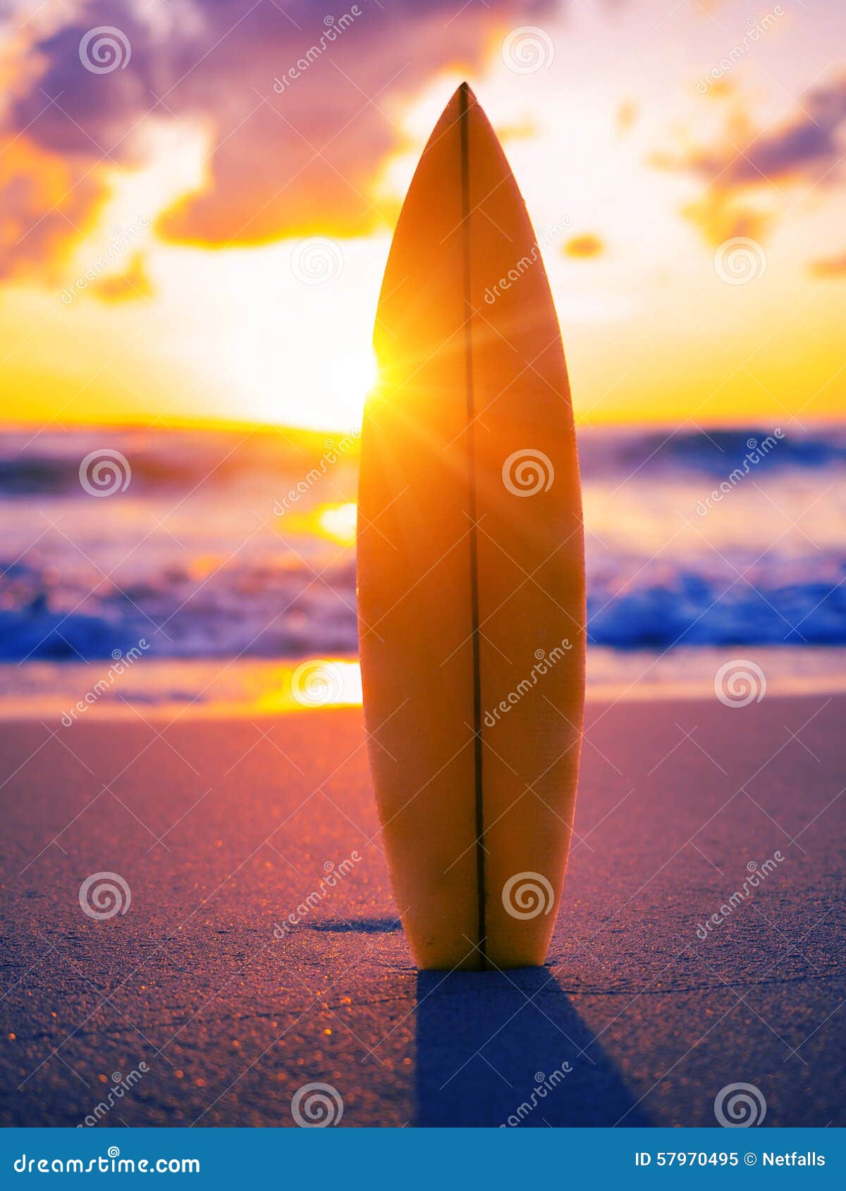 Surfboard In Sand And Sunset