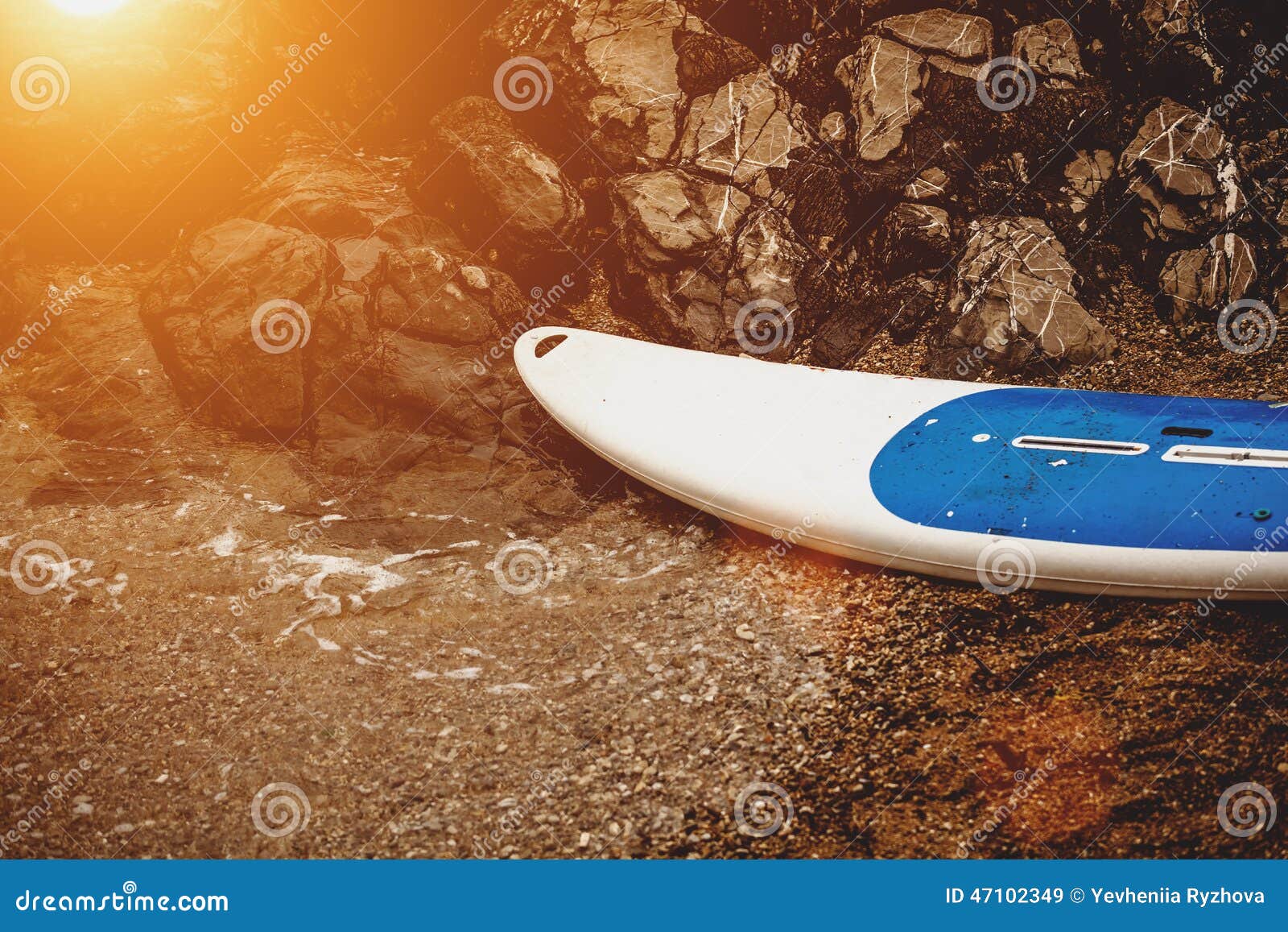 Surfboard Lying on Sandy Beach at Sunset Rays Stock Image - Image of ...
