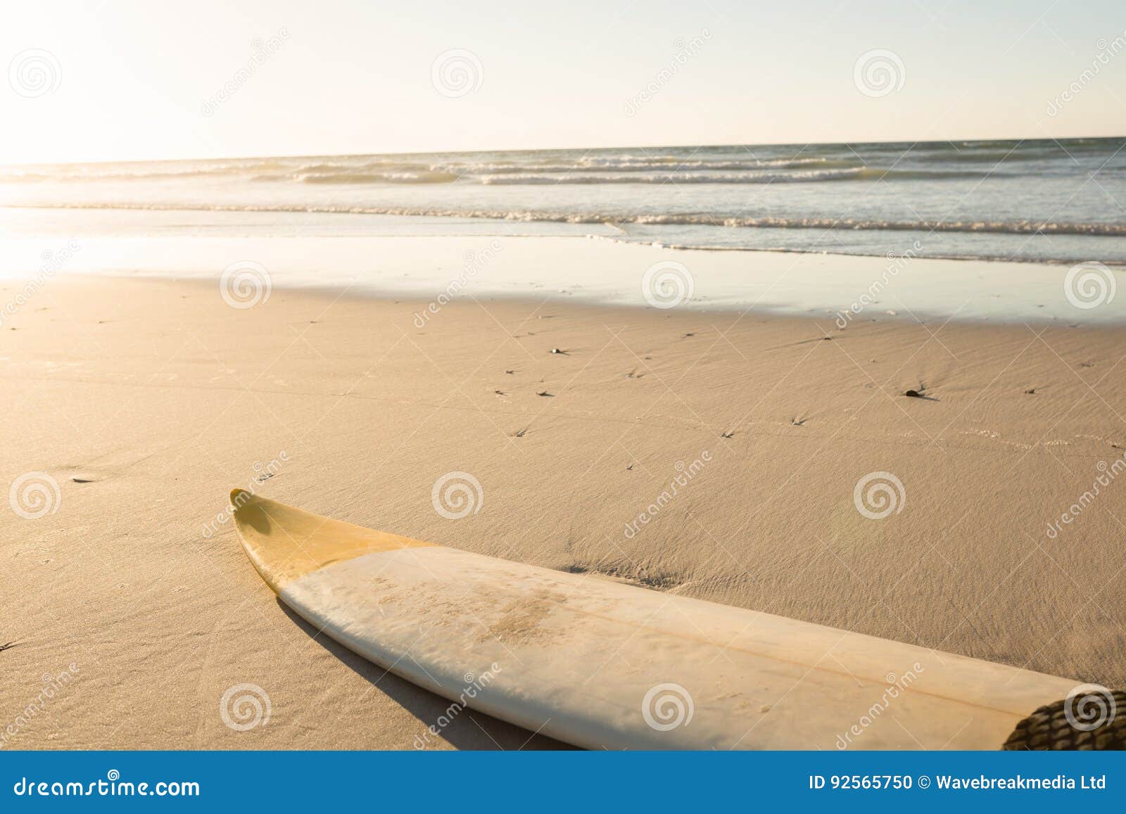 Surfboard on sand at beach stock photo. Image of tranquil - 92565750