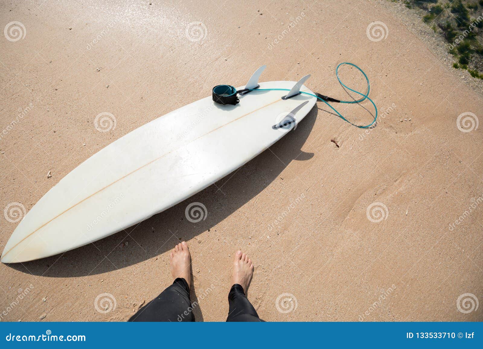 Surfboard and Surfer Legs on Beach Stock Photo - Image of tropical ...