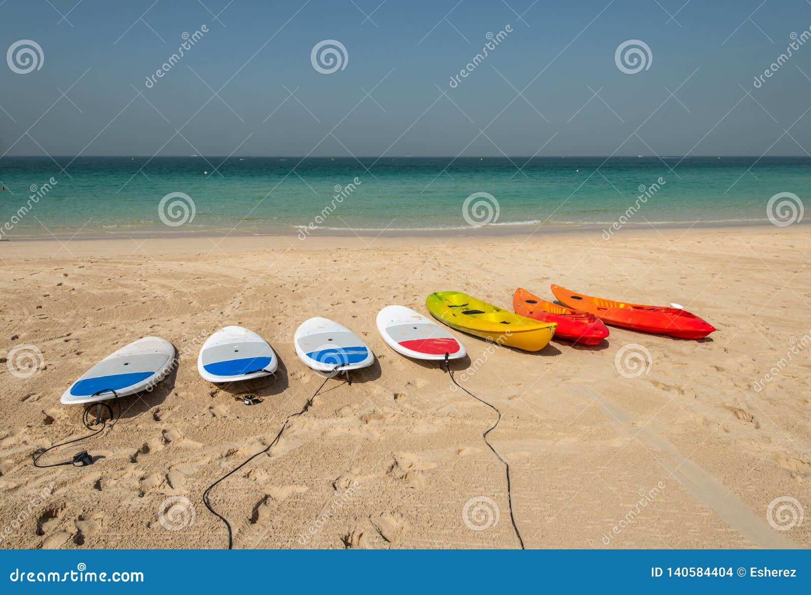 Surfboards and Kayaks on the Sandy Beach Stock Photo - Image of ...