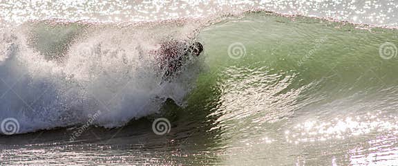 Surfer in a Barrel Falling Under the Force of the Waves Stock Photo ...