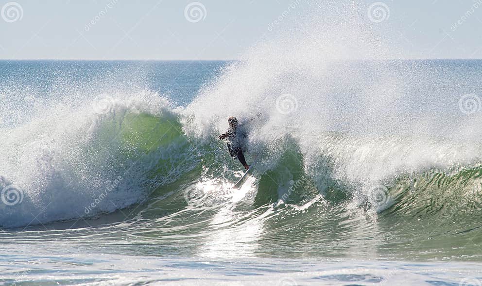 Surfer in a Barrel Falling Under the Force of the Waves Stock Image ...