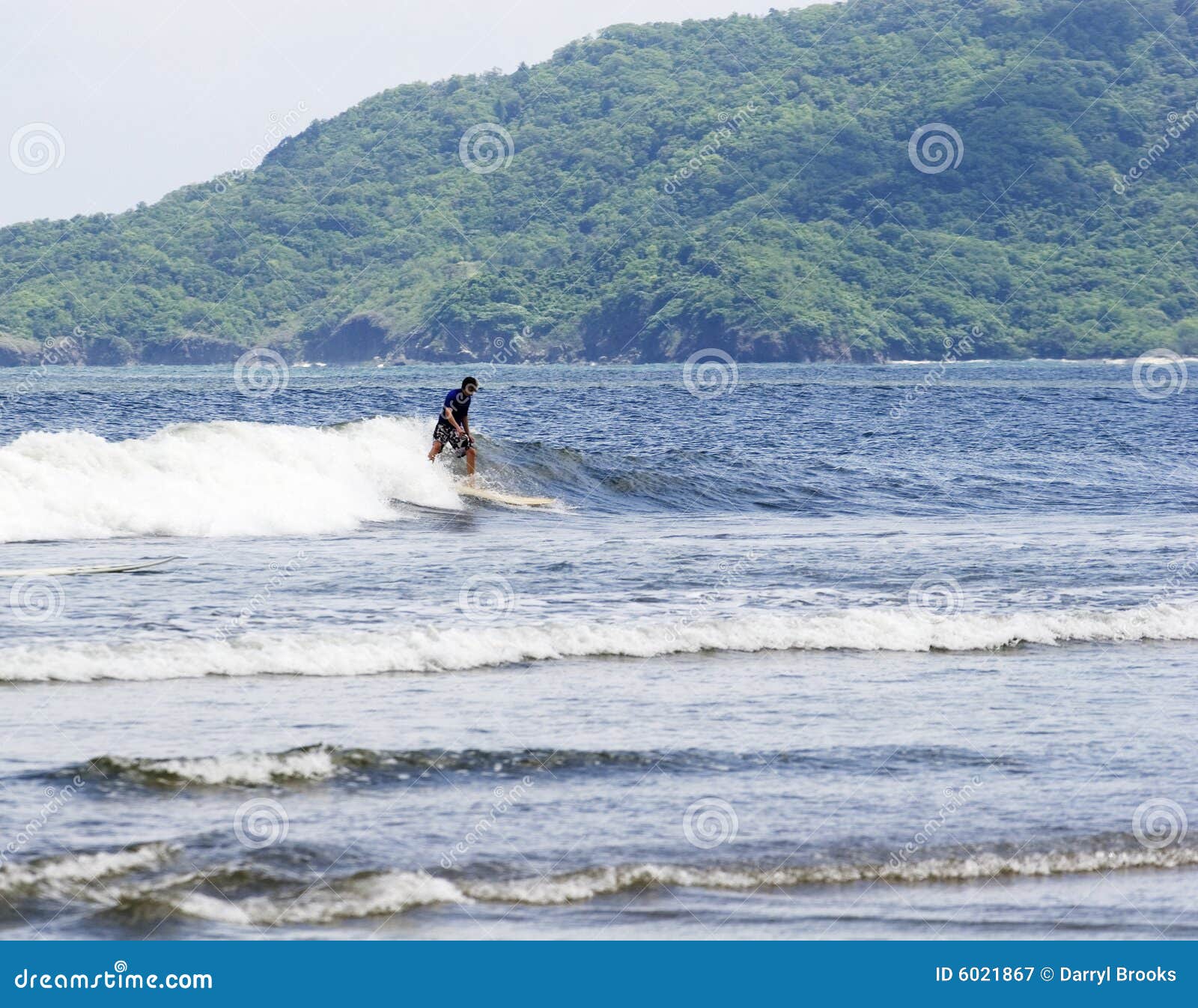 Surfer in Blue stock image. Image of shore, board, sand - 6021867
